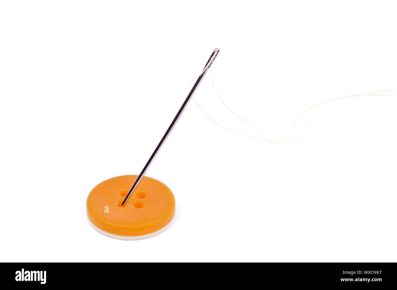 Yellow Button and Needle with Yellow Thread isolated on white ...