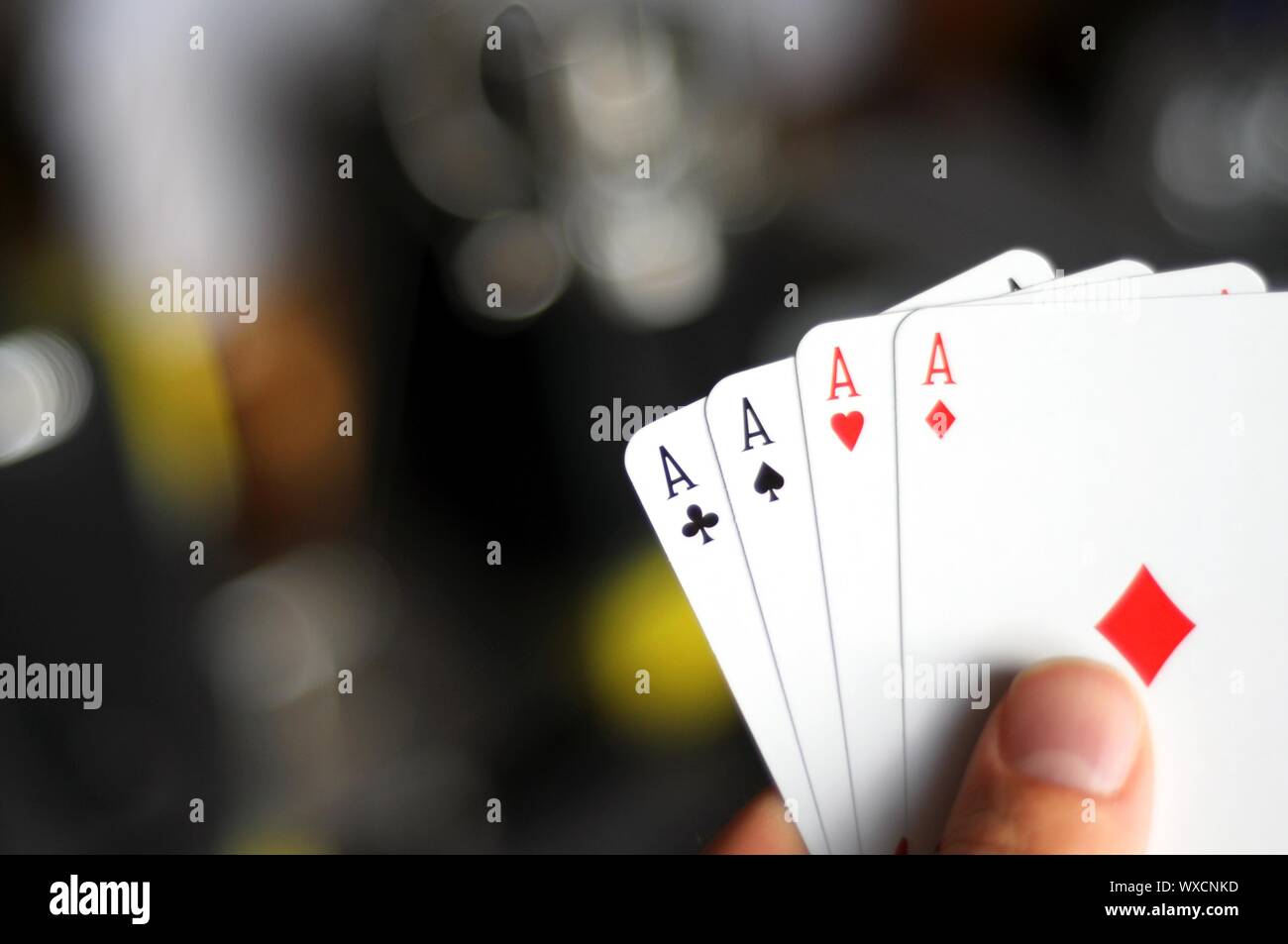 hand and four aces showing poker concept with copyspace Stock Photo - Alamy