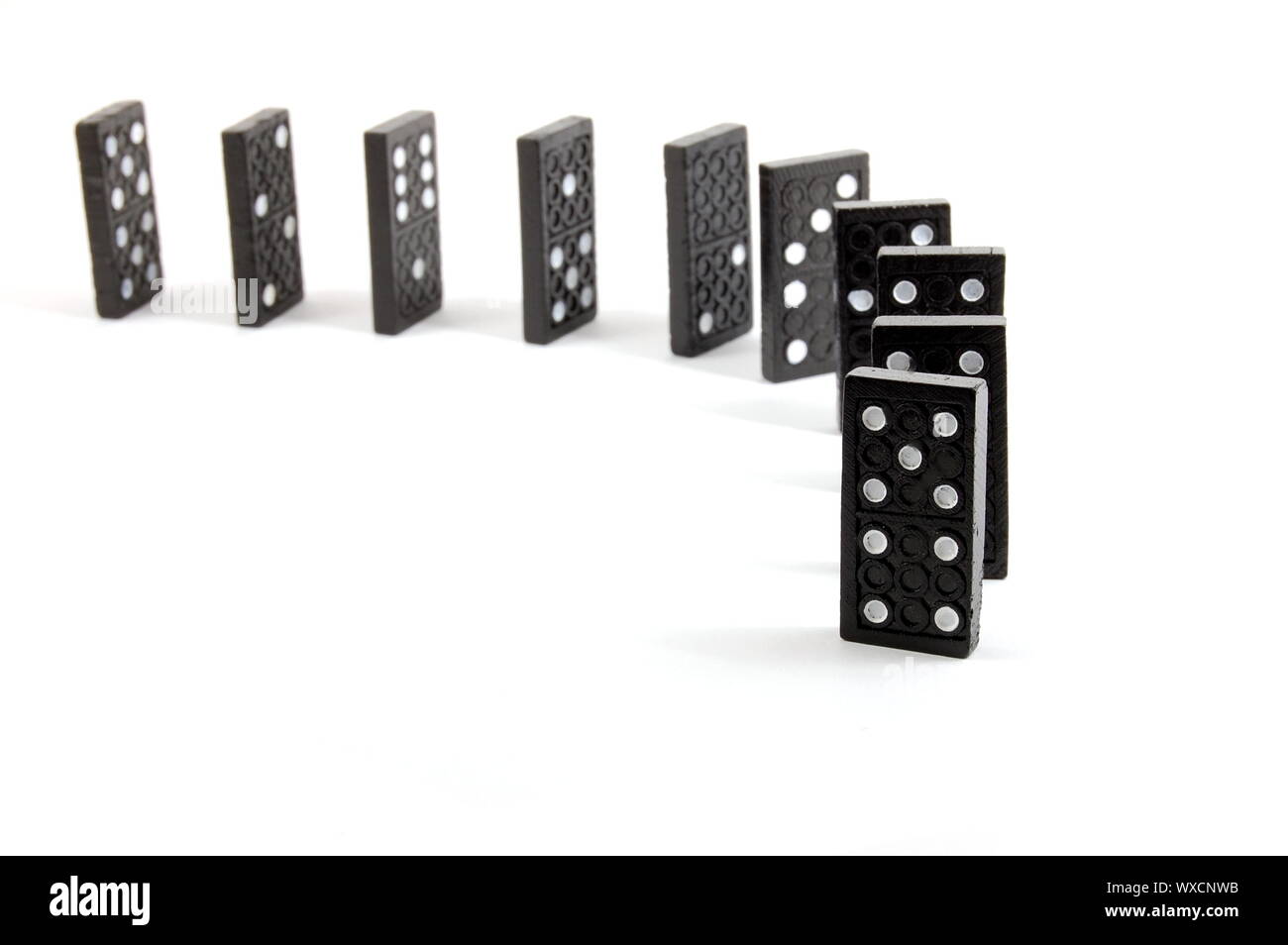 chain of dominoes isolated on a white background Stock Photo - Alamy