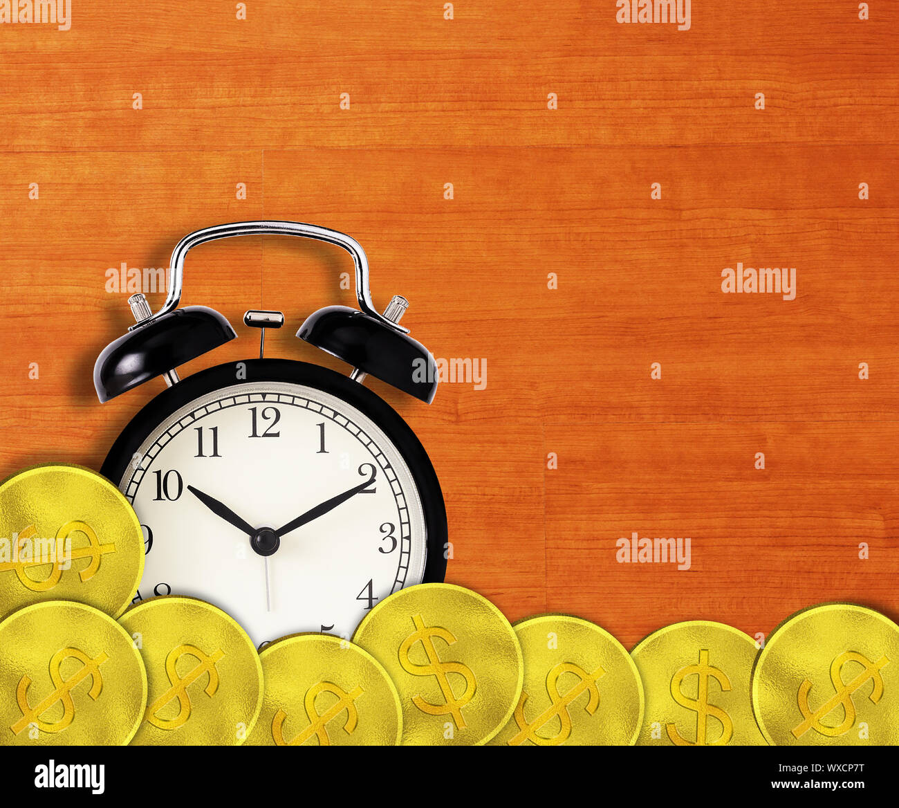 Time is money concept, alarm clock and gold coin Stock Photo - Alamy