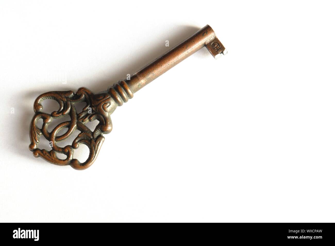 old vintage key isolated on a white background Stock Photo - Alamy