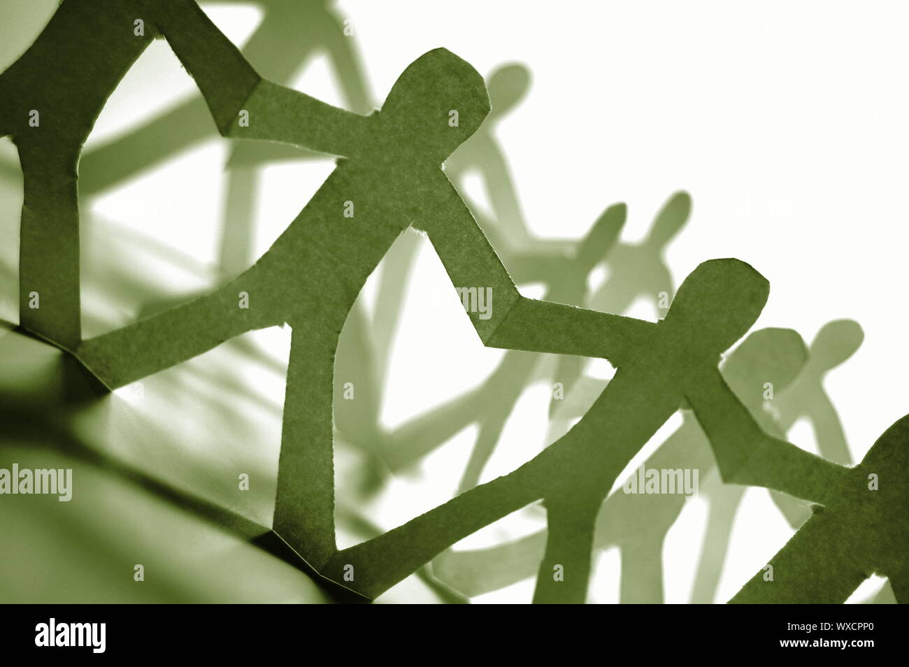 paper people doing teamwork in their business Stock Photo - Alamy