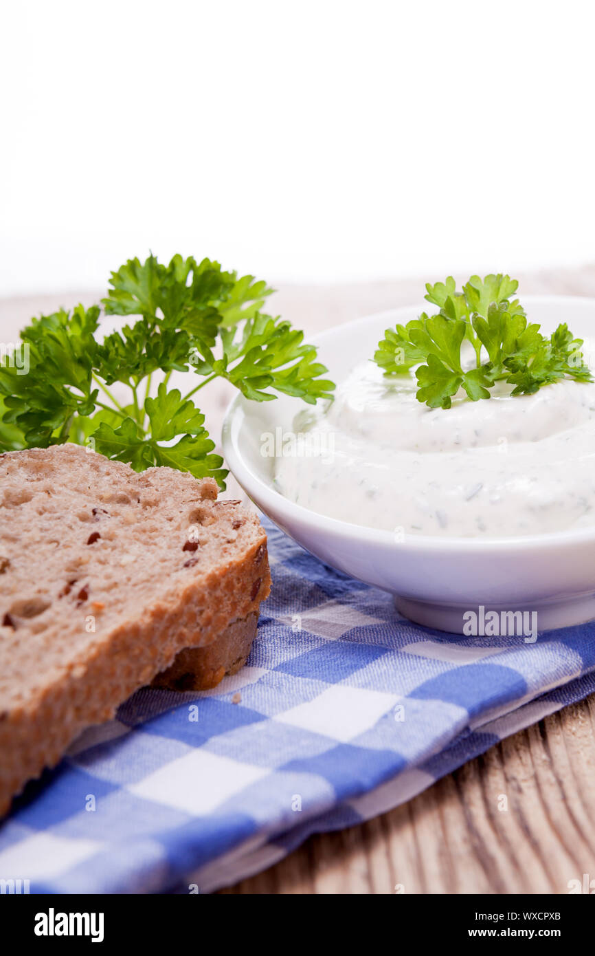 fresh tasty herbal creme cheese and bread on wooden table Stock Photo ...