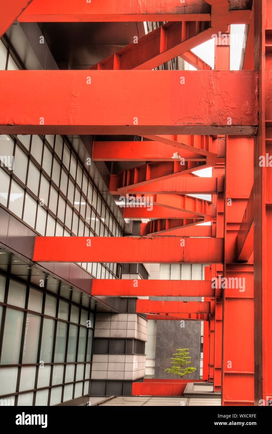 Abstract modern building structure with red column Stock Photo - Alamy