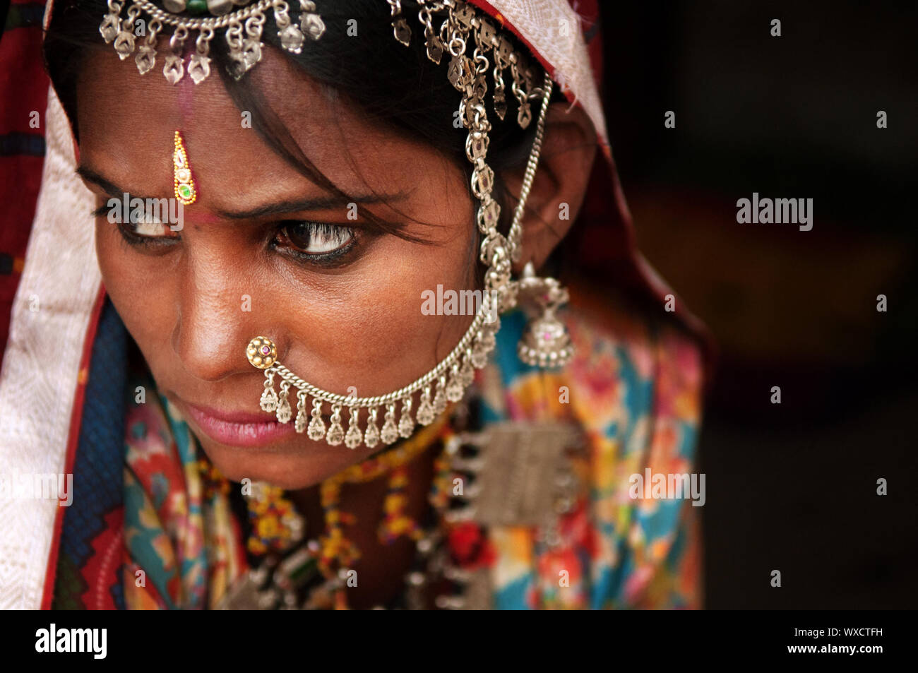 Portrait of Traditional Indian woman in sari costume covered her face ...