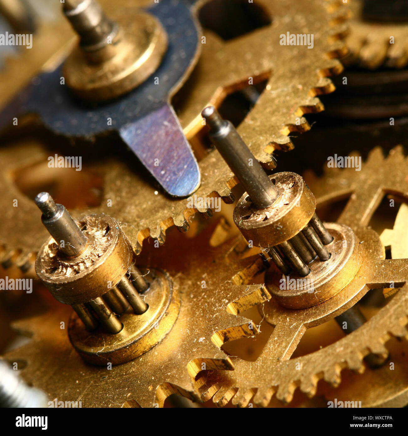 time gear inside my rare clock Stock Photo - Alamy