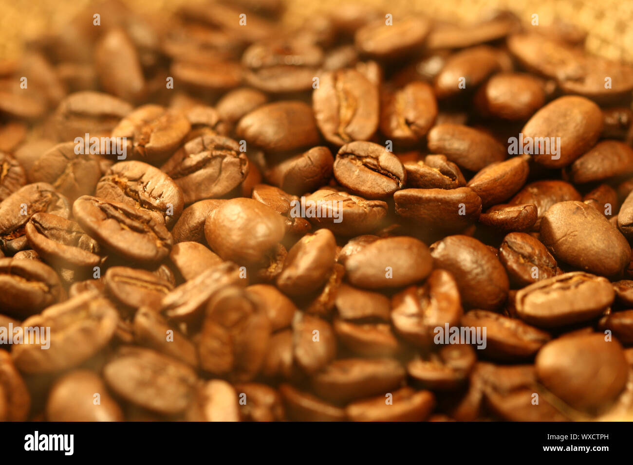very hot big black coffee beans macro Stock Photo - Alamy