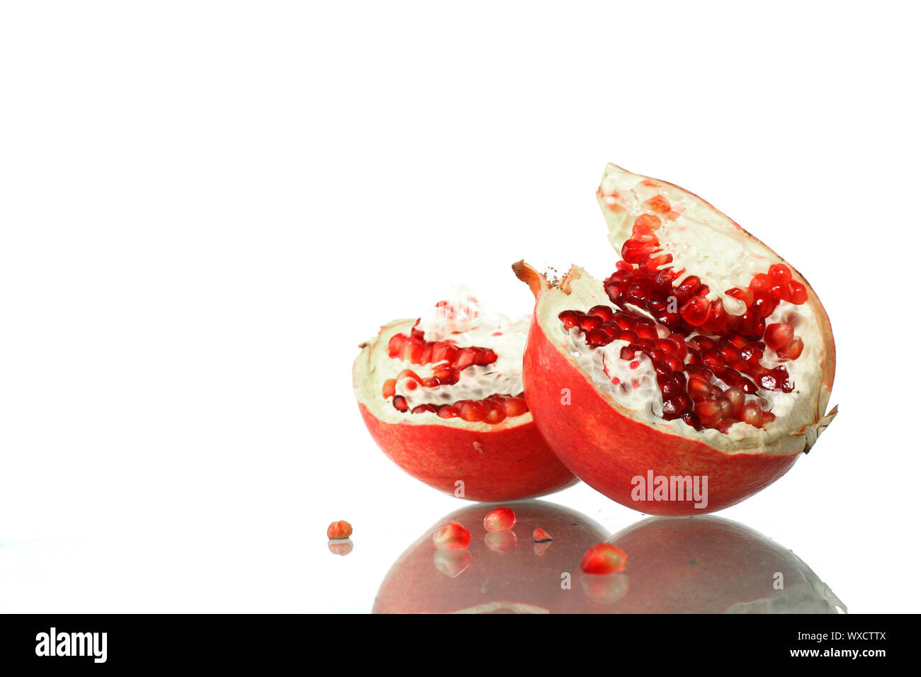pomegranate macro close up on white background Stock Photo - Alamy