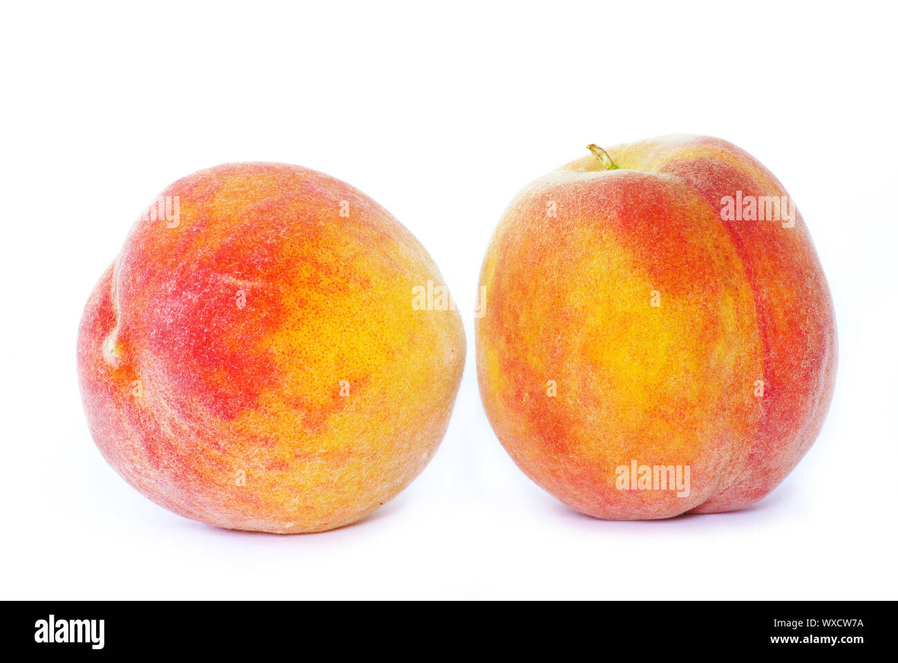 two peach isolated on white Stock Photo - Alamy