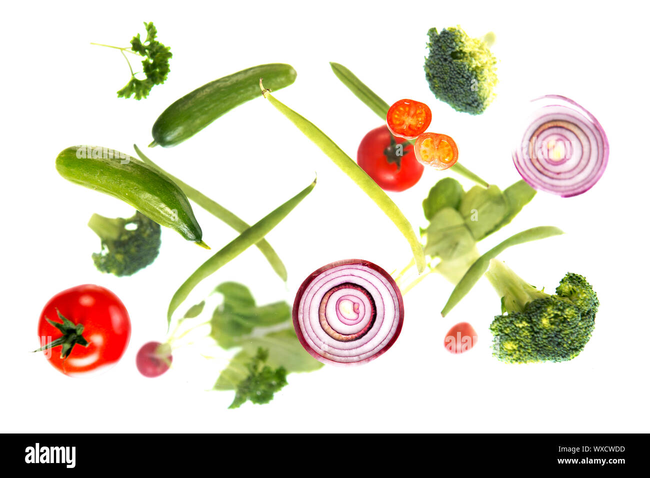 Floating mixed vegetables on white background Stock Photo - Alamy