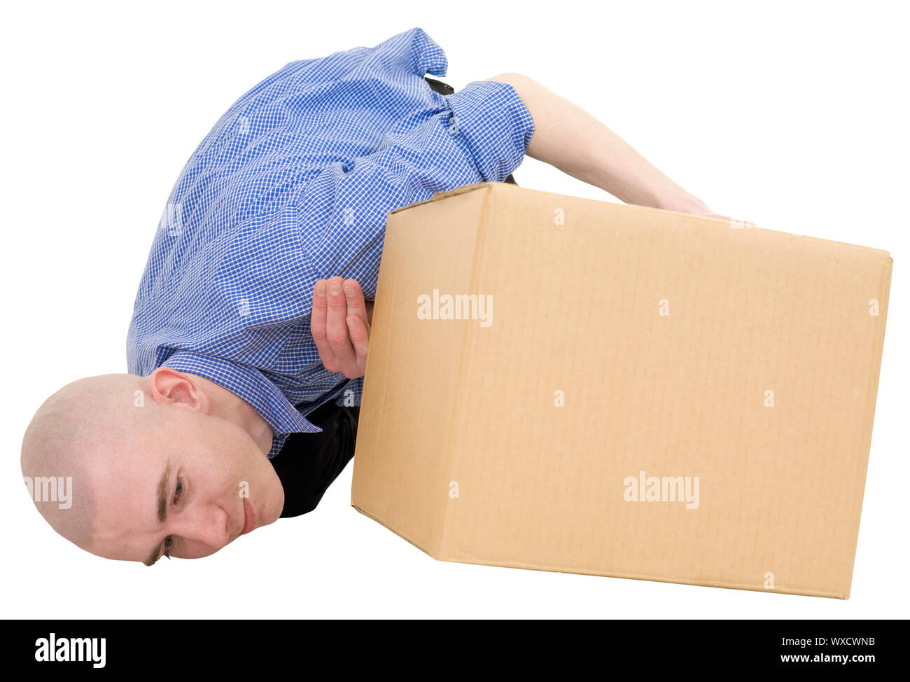 Man looking under cardboard box on white Stock Photo - Alamy