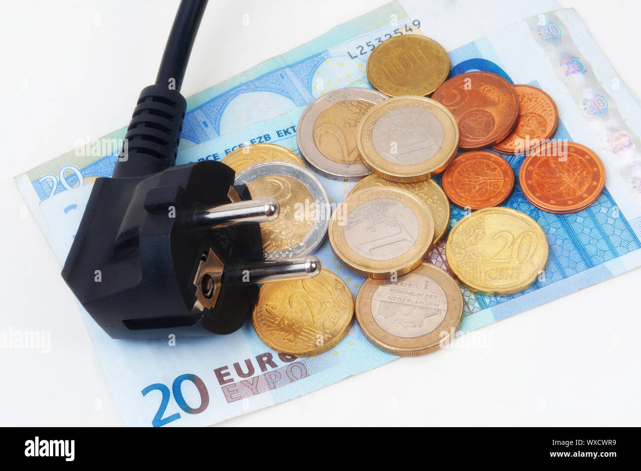 Isolated Power plug with European Banknote and coins - electricity ...