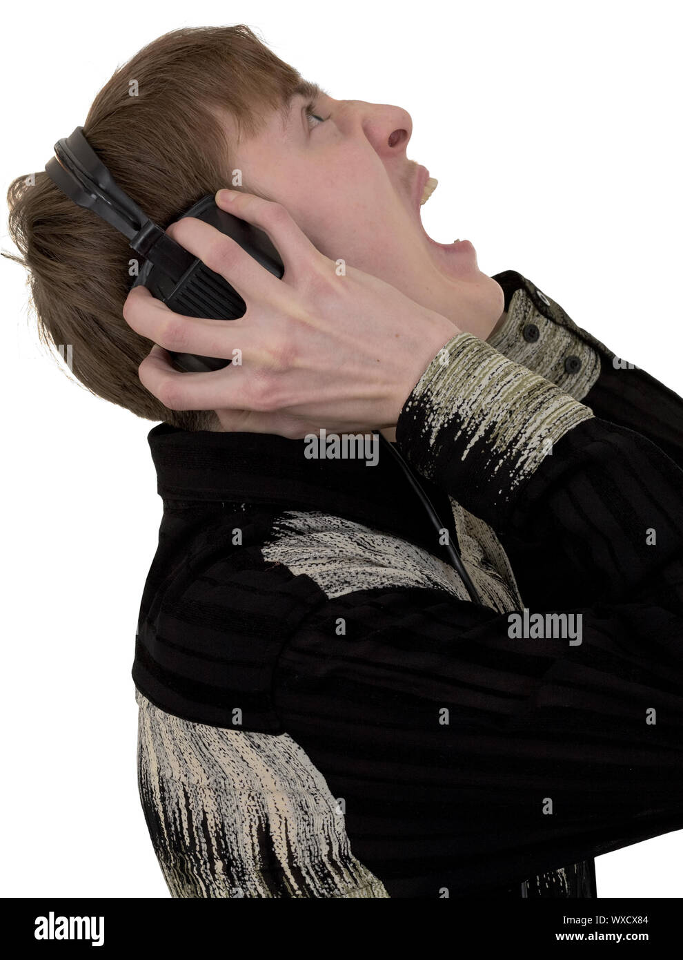 The person in ear-phones shouting at a white background Stock Photo - Alamy
