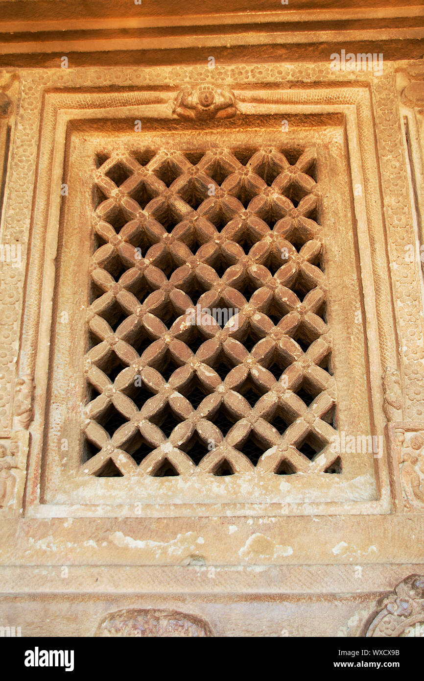 Vertical stone window with floral design at Durga Temple in Aihole ...