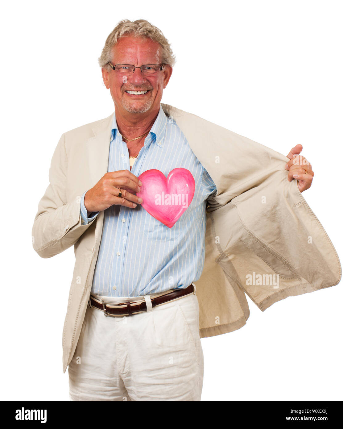 A healthy happy man holding up a love heart in front of his heart ...
