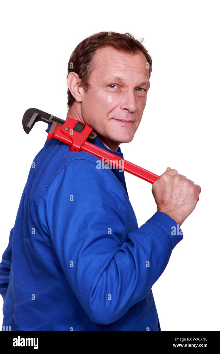 Worker with a pipe wrench Stock Photo - Alamy