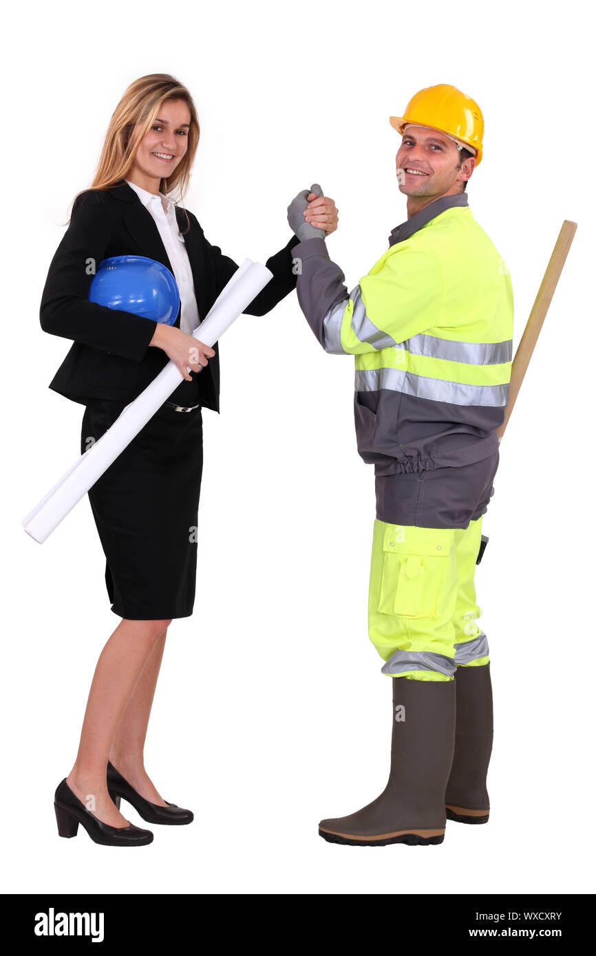 Engineer and a construction worker making a pact Stock Photo - Alamy