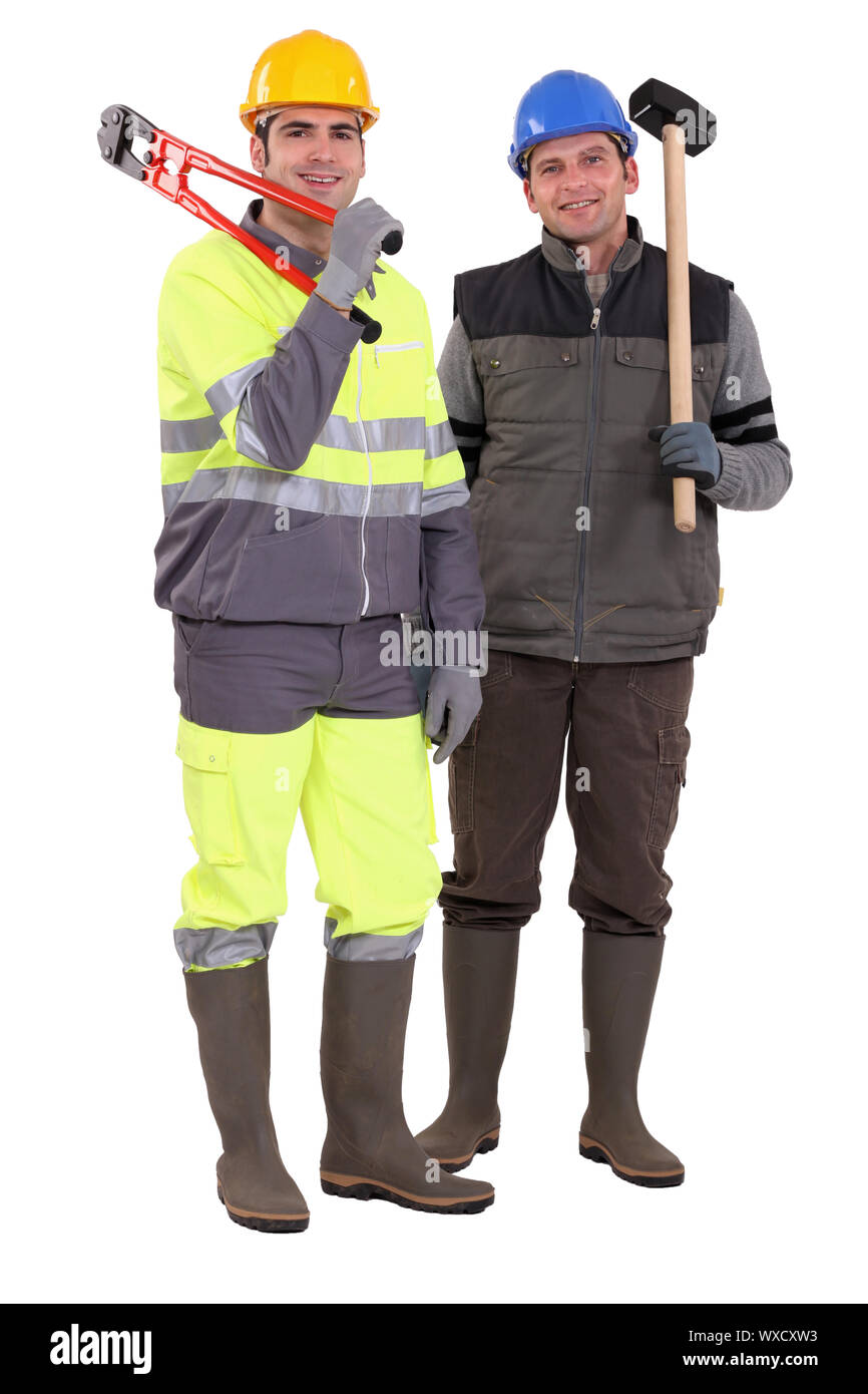 Two builder stood next to each other Stock Photo - Alamy