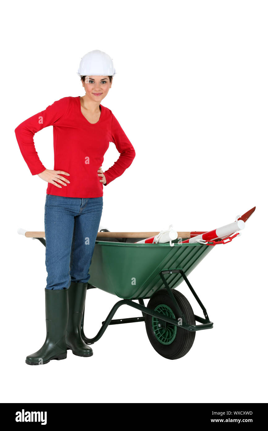 Construction worker with a wheelbarrow Stock Photo - Alamy