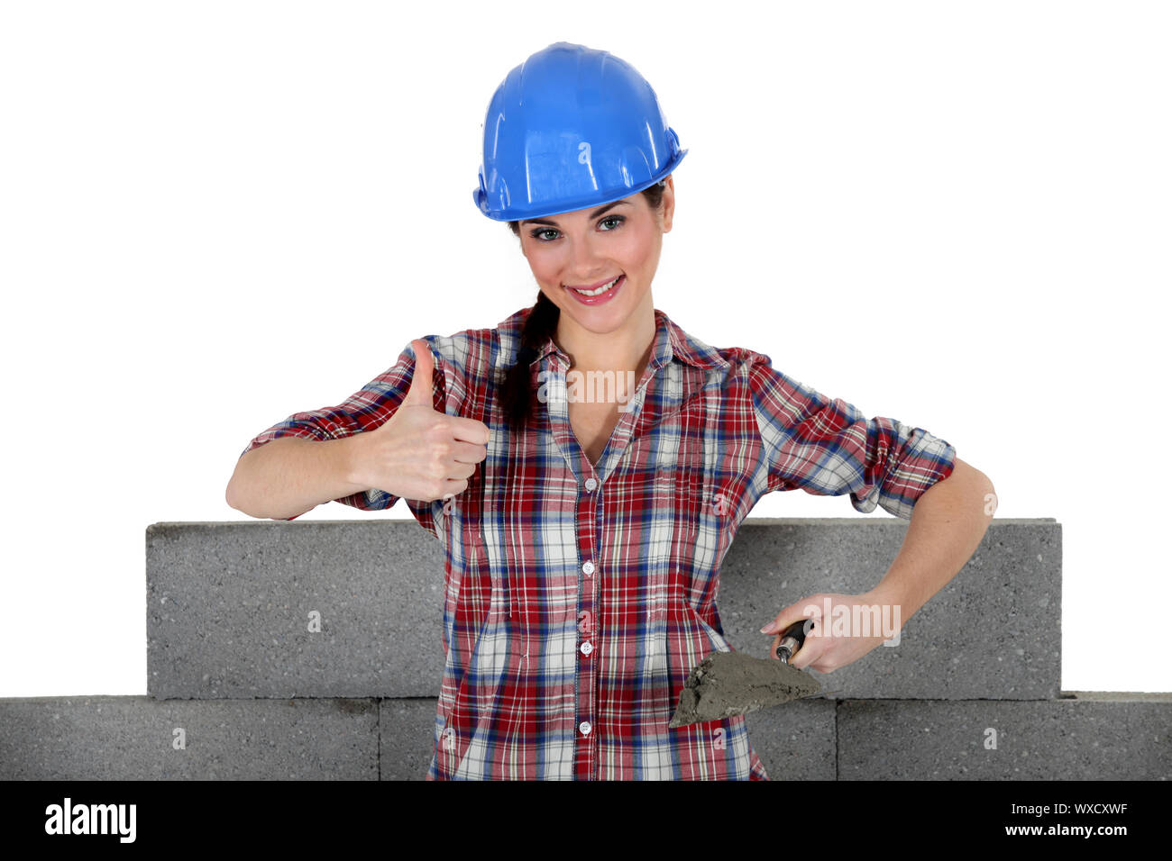 Woman building wall Stock Photo - Alamy