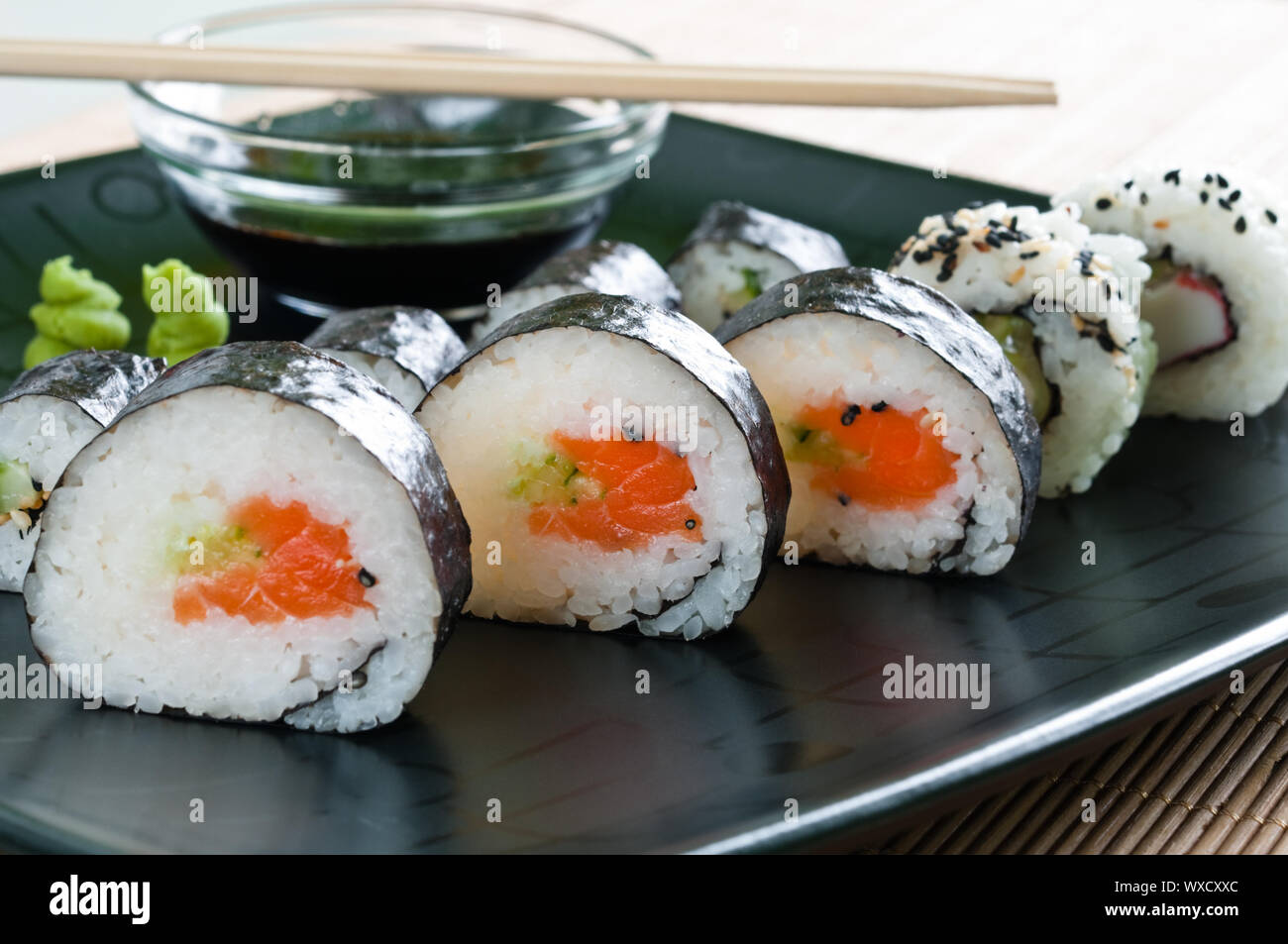 Selection of Japanese sushi arranged on black plate Stock Photo - Alamy