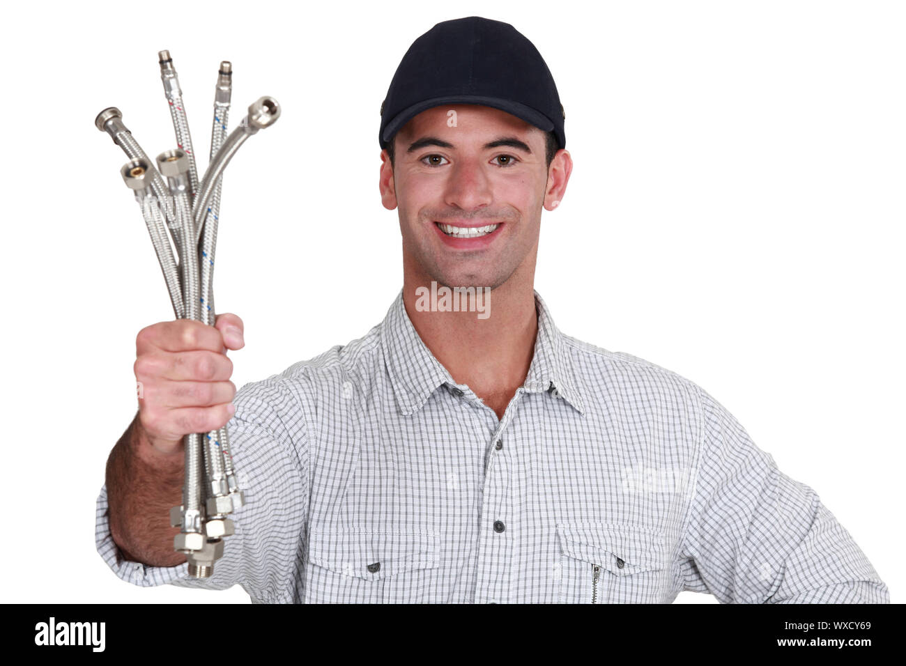 Plumber with flexible pipes Stock Photo - Alamy