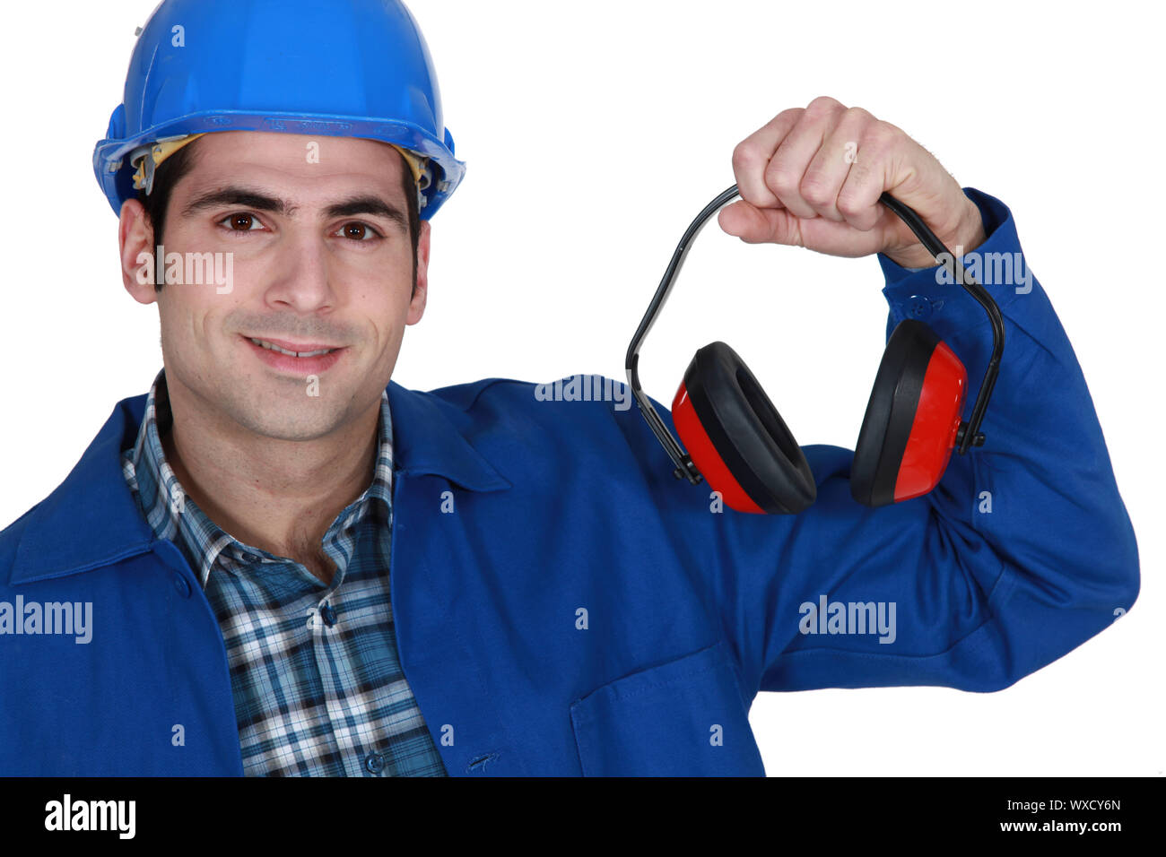 Construction worker with ear defenders Stock Photo - Alamy
