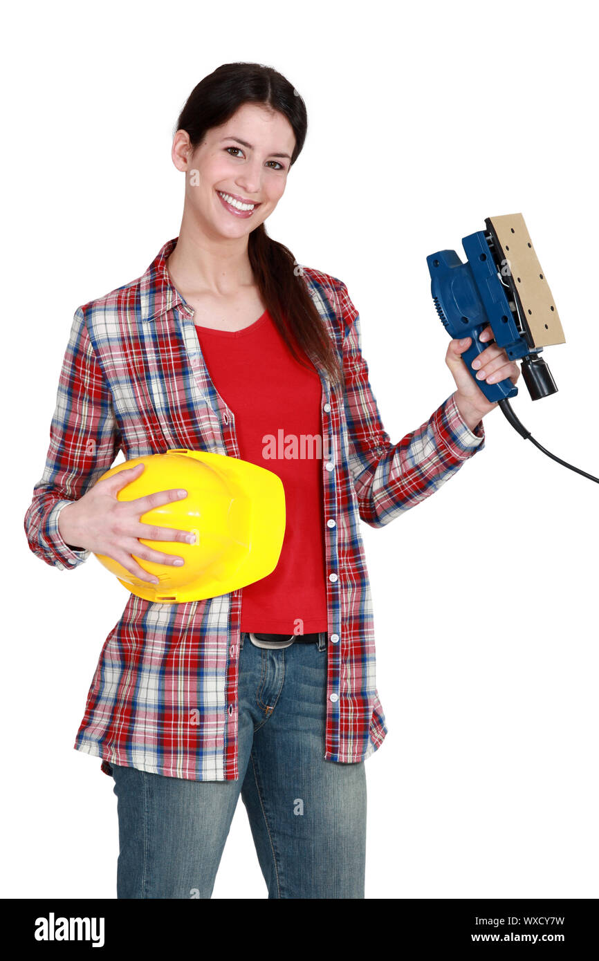 Woman holding a sander Stock Photo - Alamy