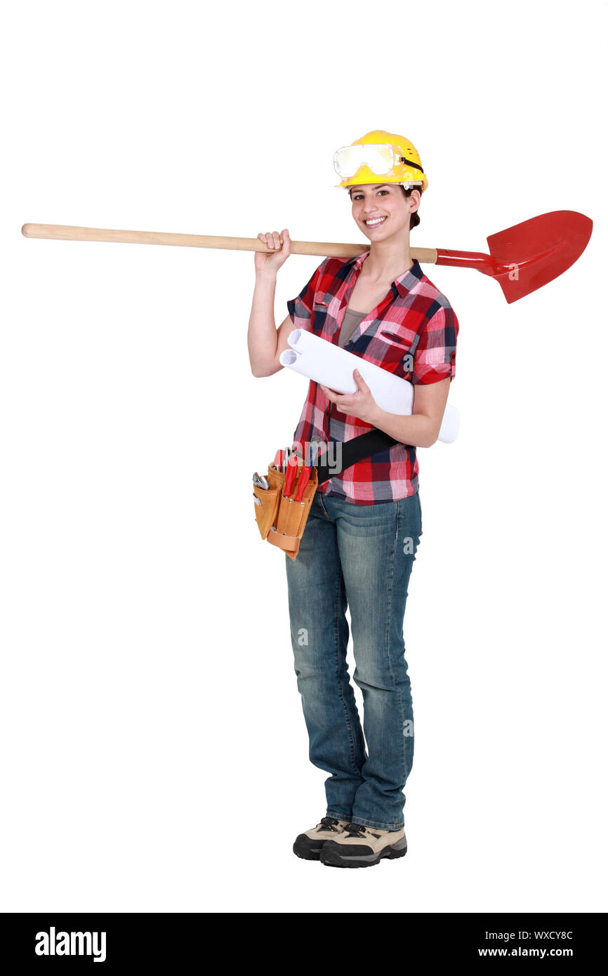 Female construction worker holding plans and spade Stock Photo - Alamy