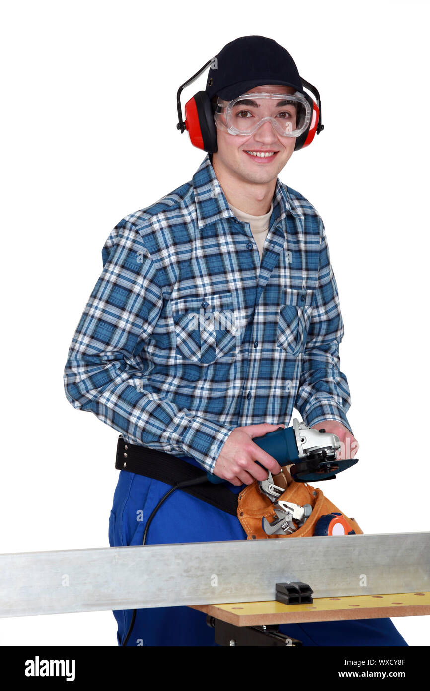 Man using angle grinder Stock Photo - Alamy