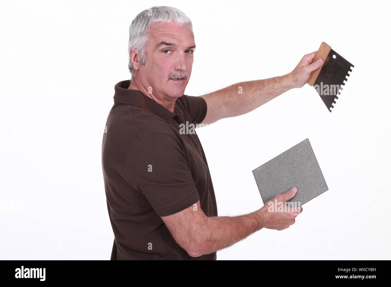 Tiller with a grout comb Stock Photo - Alamy
