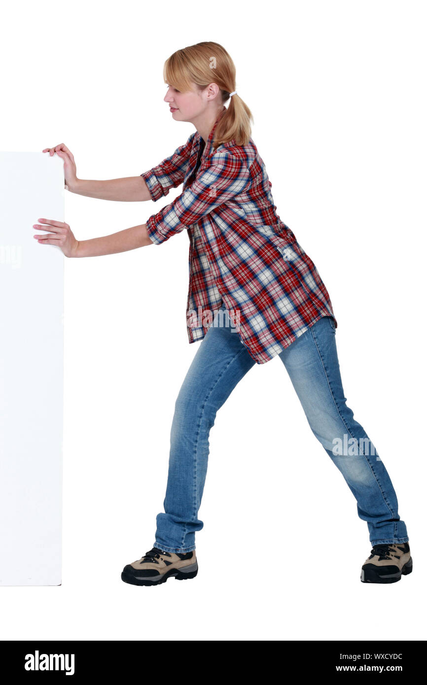 Woman pushing a blank sign Stock Photo - Alamy