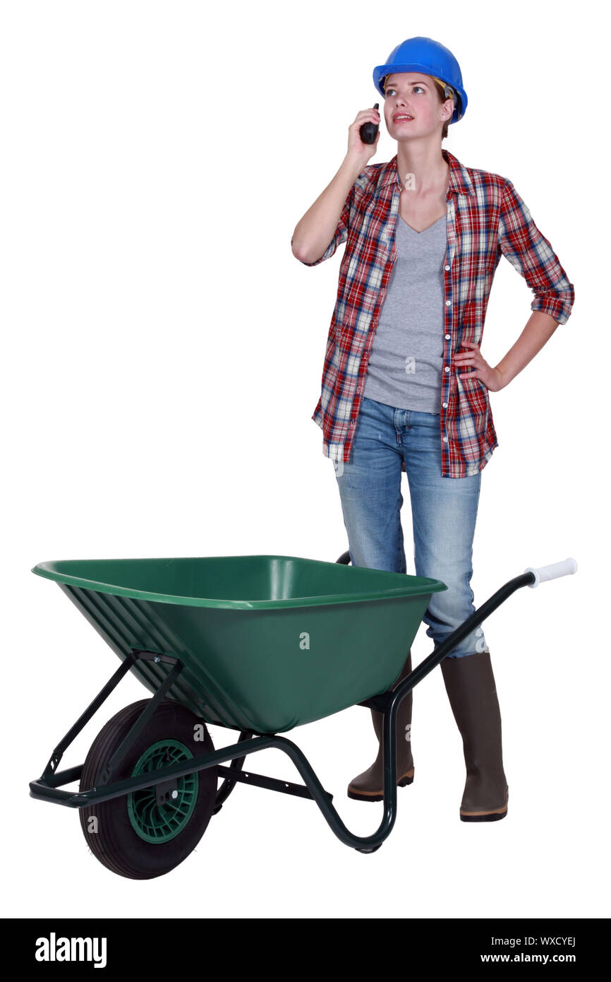 Woman with wheelbarrow and radio receiver Stock Photo - Alamy