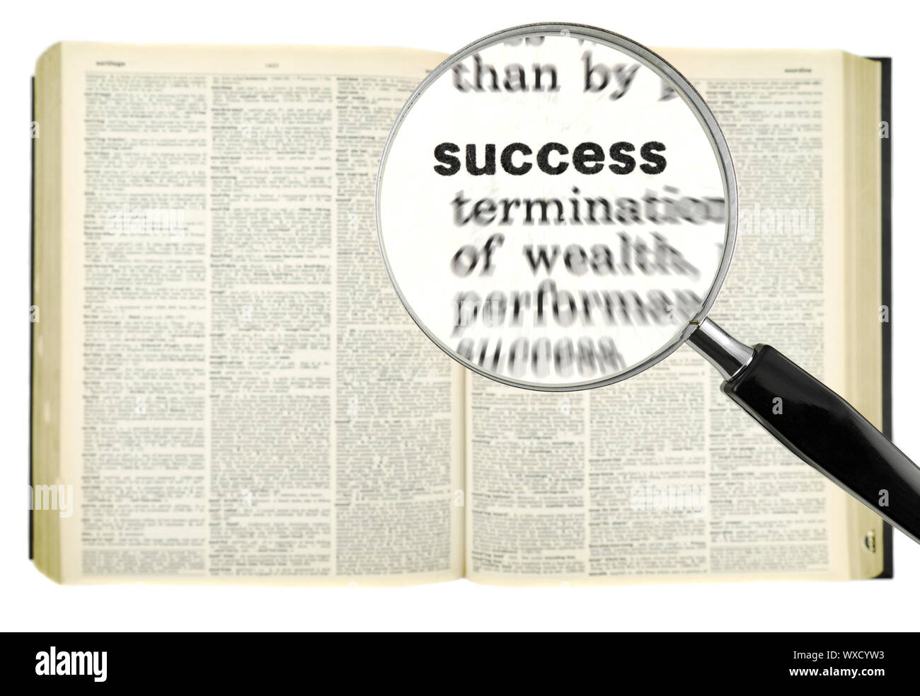 A magnifying glass on the world SUCCESS on a dictionary Stock Photo - Alamy