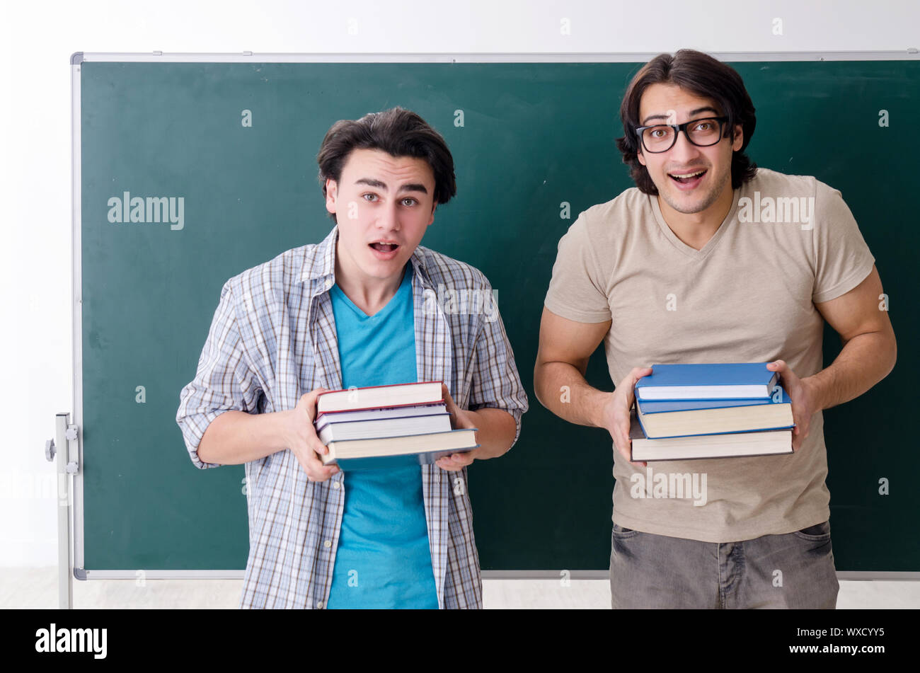 Two male students in the classroom Stock Photo - Alamy