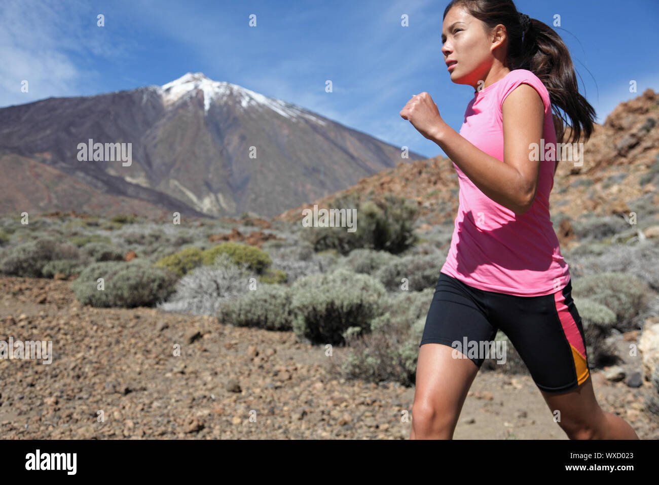 Runner. Woman running outside in beautiful nature Stock Photo - Alamy
