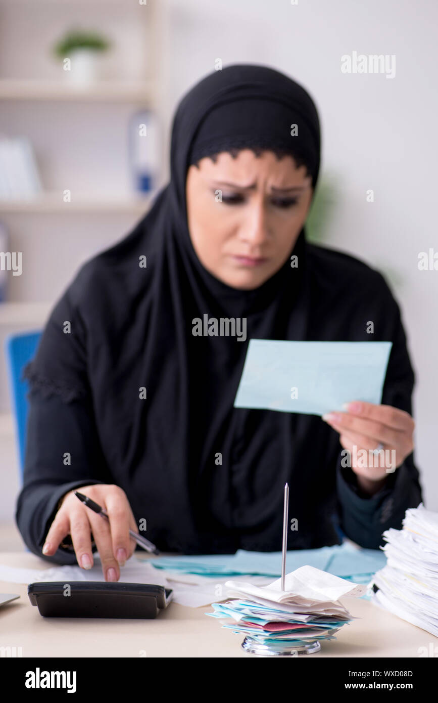 Female employee bookkeeper in hijab working in the office Stock Photo ...