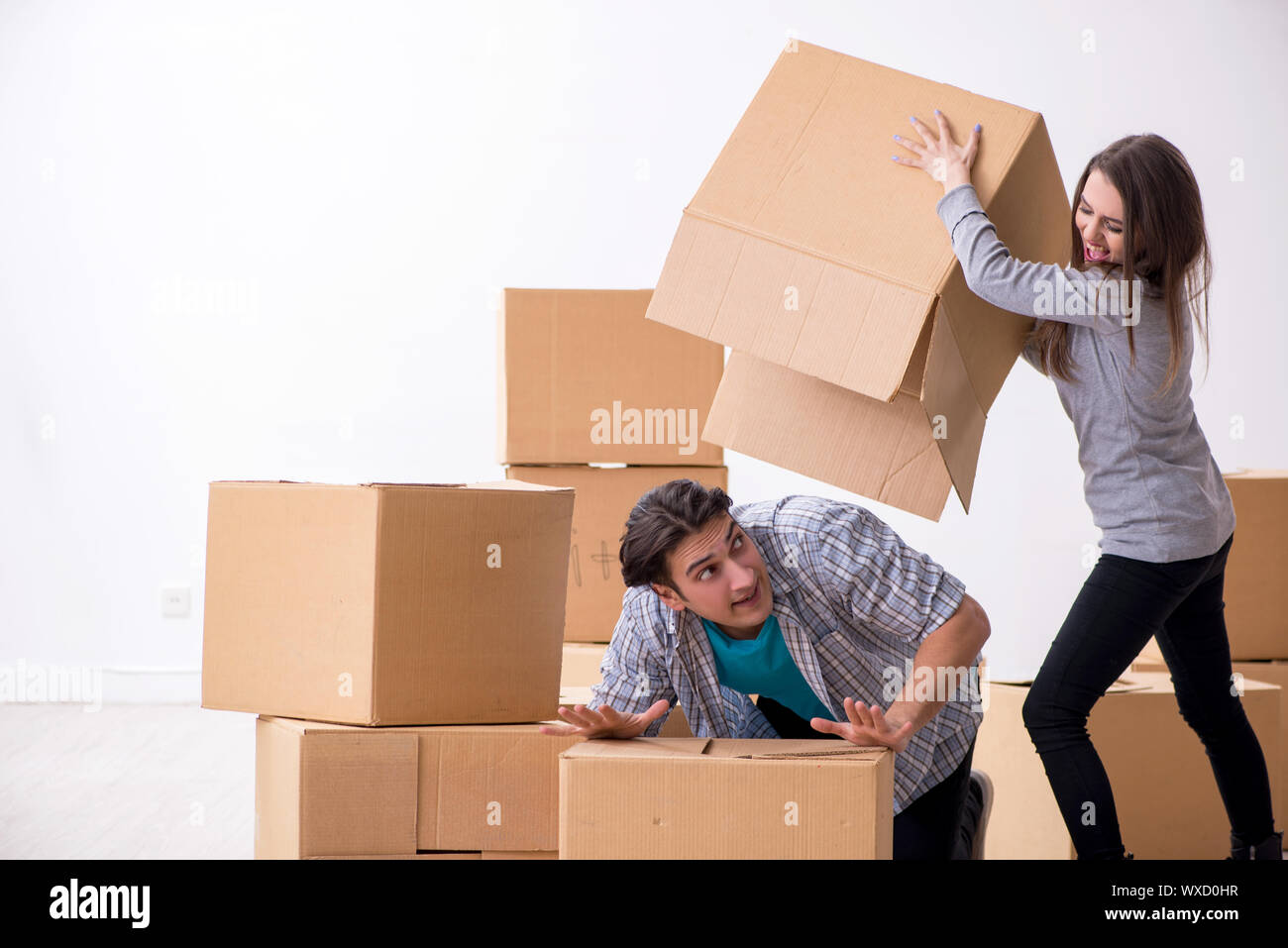 Young pair moving to new flat Stock Photo - Alamy