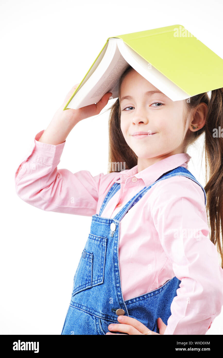 Cute girl with book on white background Stock Photo - Alamy