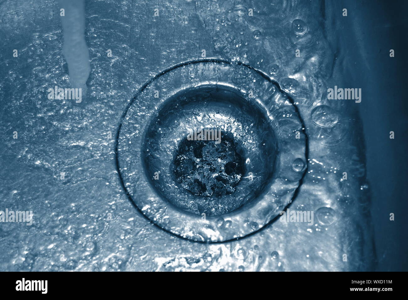 water flow into the drain in the kitchen Stock Photo - Alamy