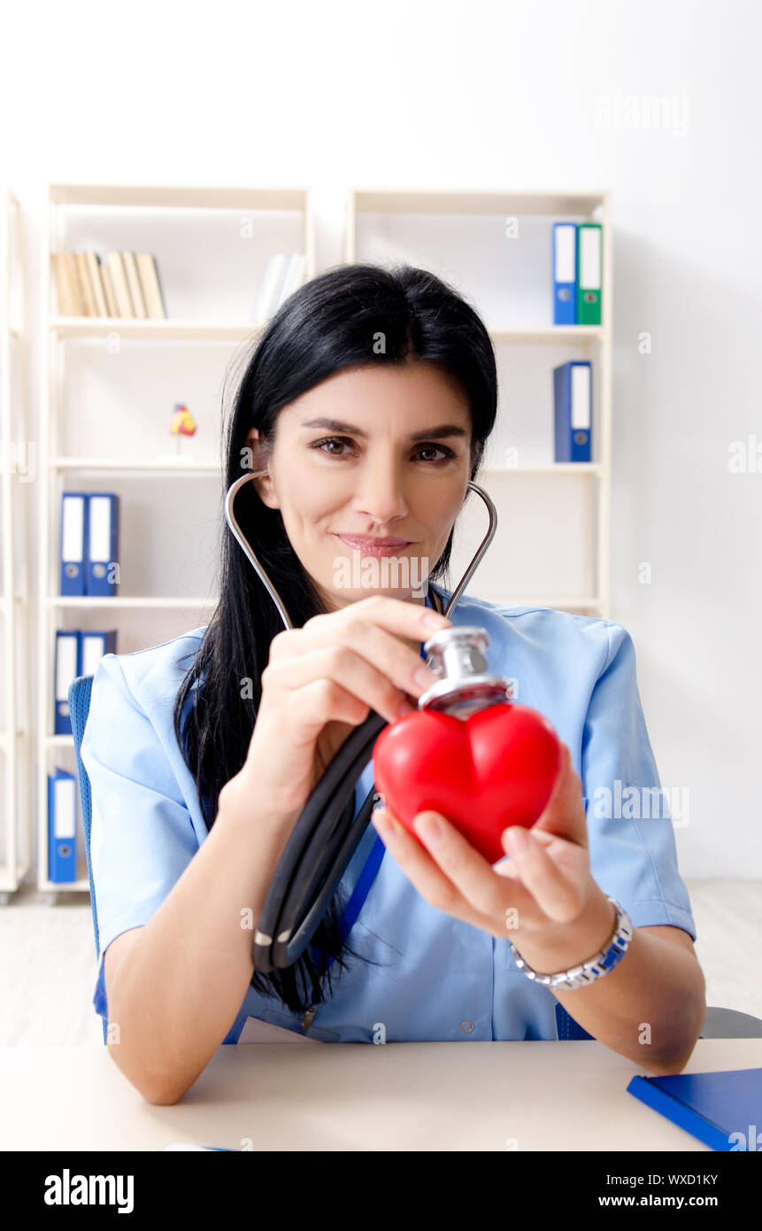 Female doctor cardiologist working in the clinic Stock Photo - Alamy
