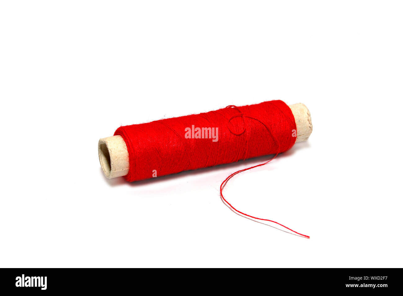 A red spool of thread Stock Photo - Alamy
