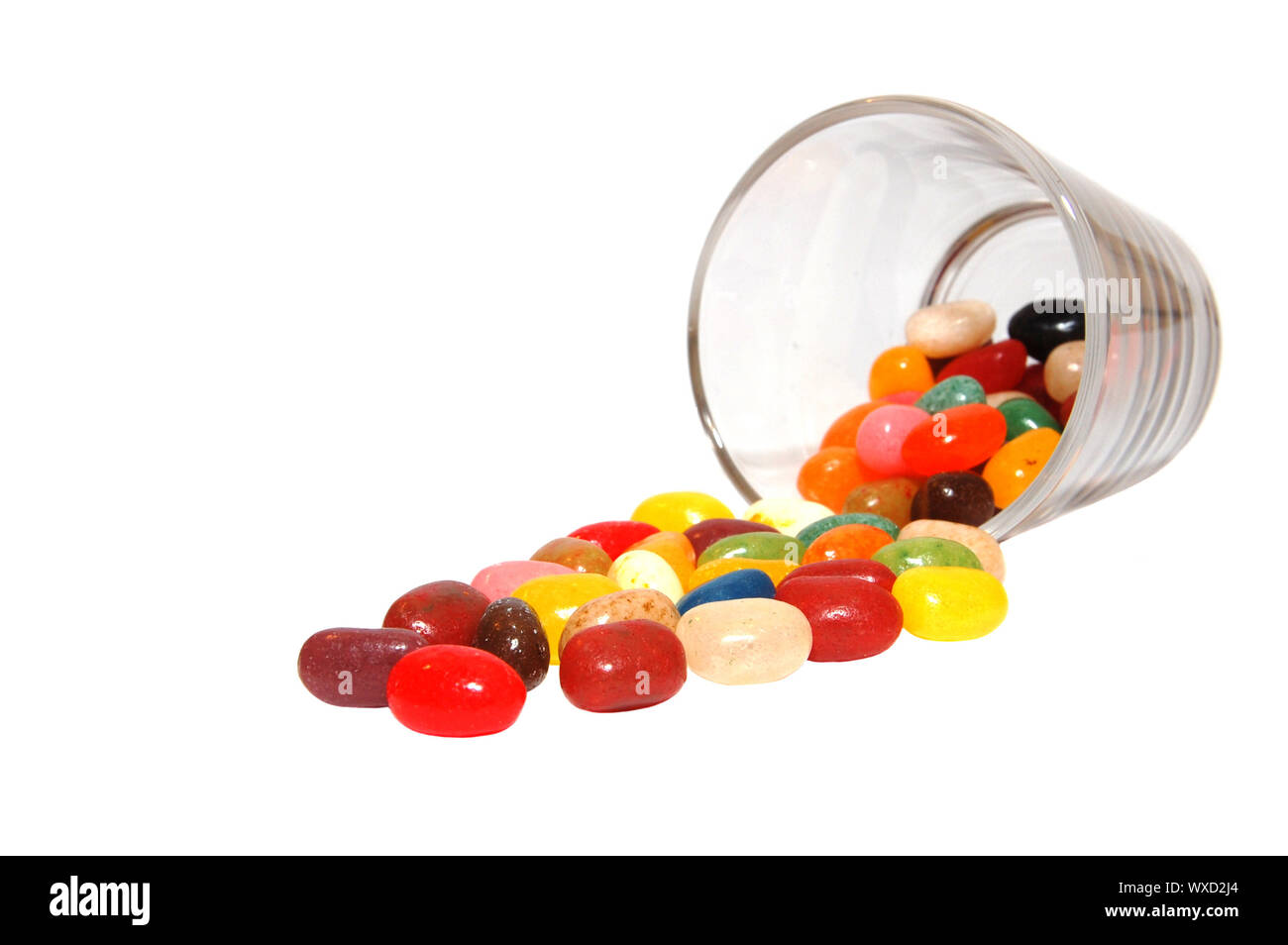 Jellybeans spilled from a glass Stock Photo - Alamy