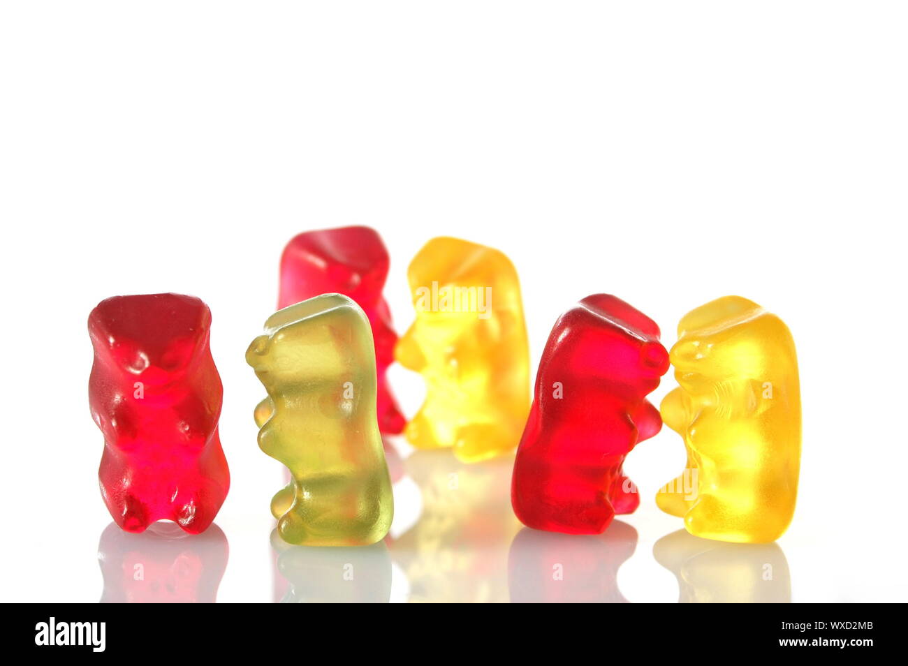 sweet gummy bears dancing on a party on white background Stock Photo ...