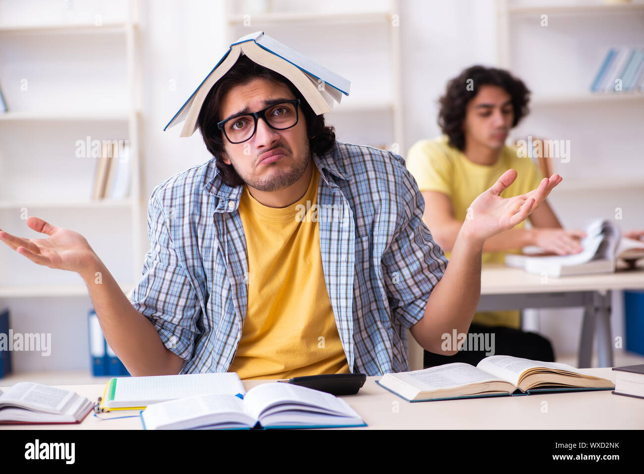 Two male students in the classroom Stock Photo - Alamy