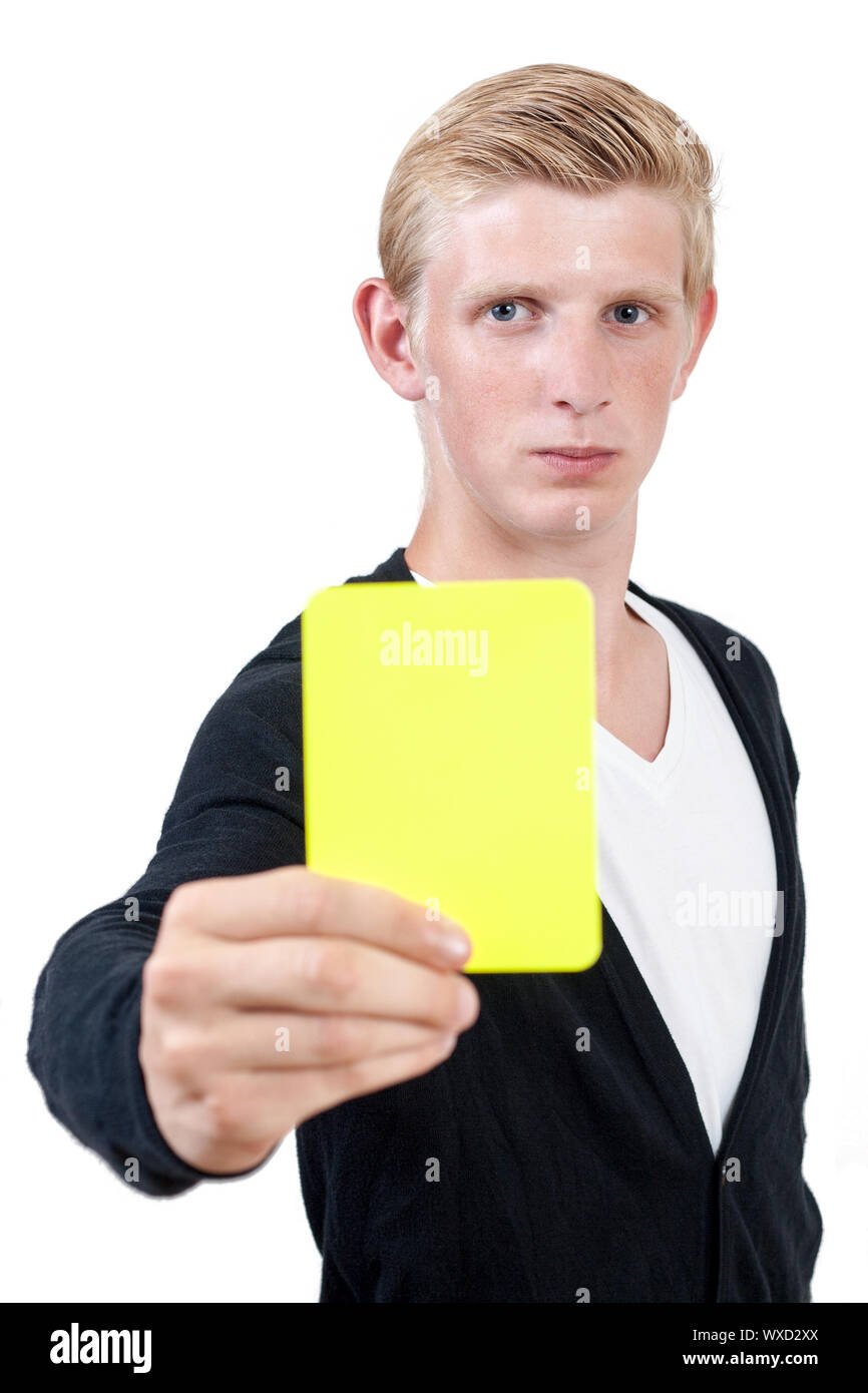 Attractive young man showing yellow card - isolated on white background ...