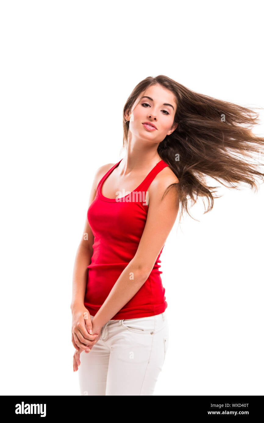 Beautiful young woman standing over a white background Stock Photo - Alamy