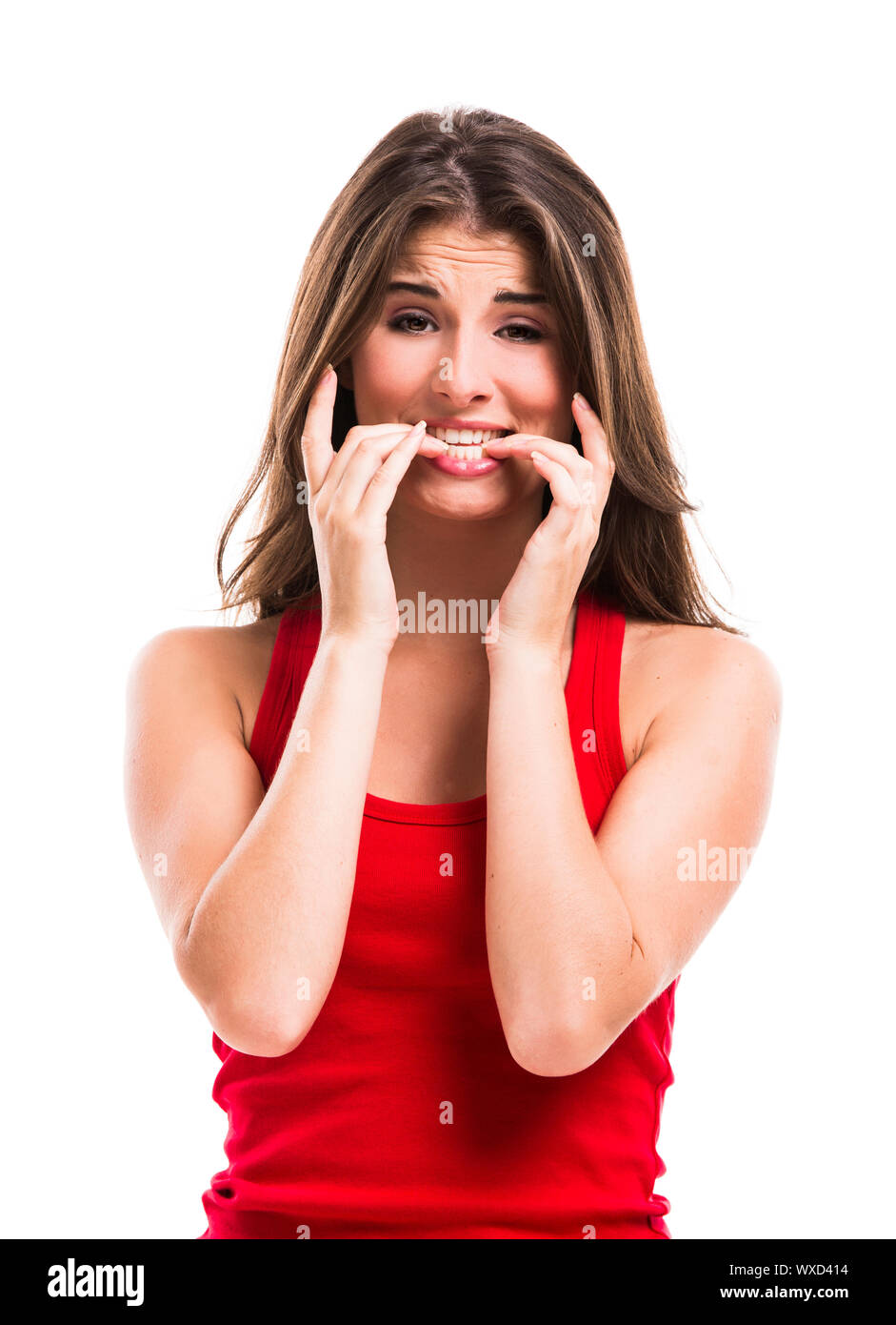Beautiful young woman biting her nails, isolated over a white ...
