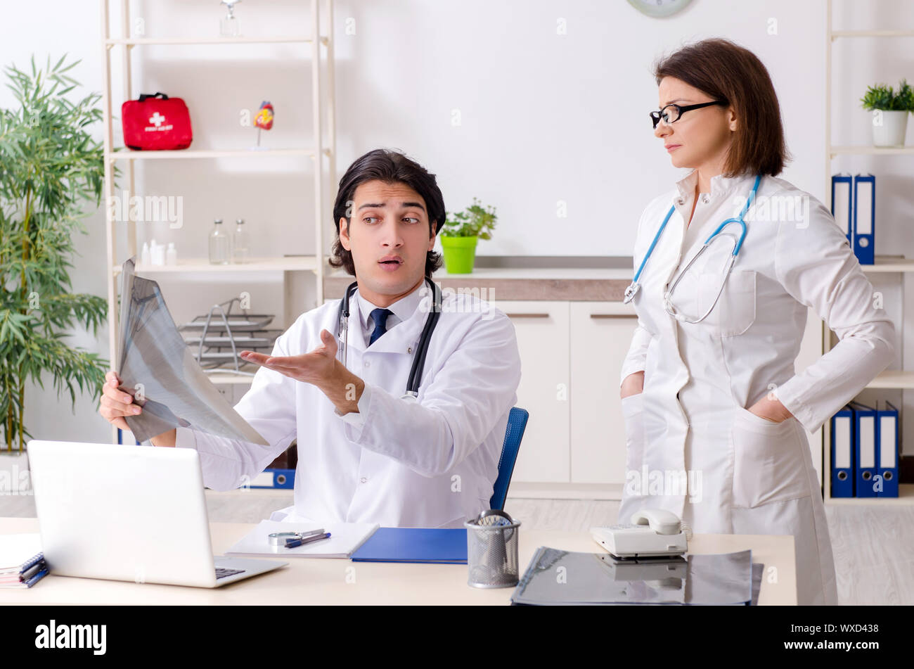 Two doctors working in the clinic Stock Photo - Alamy