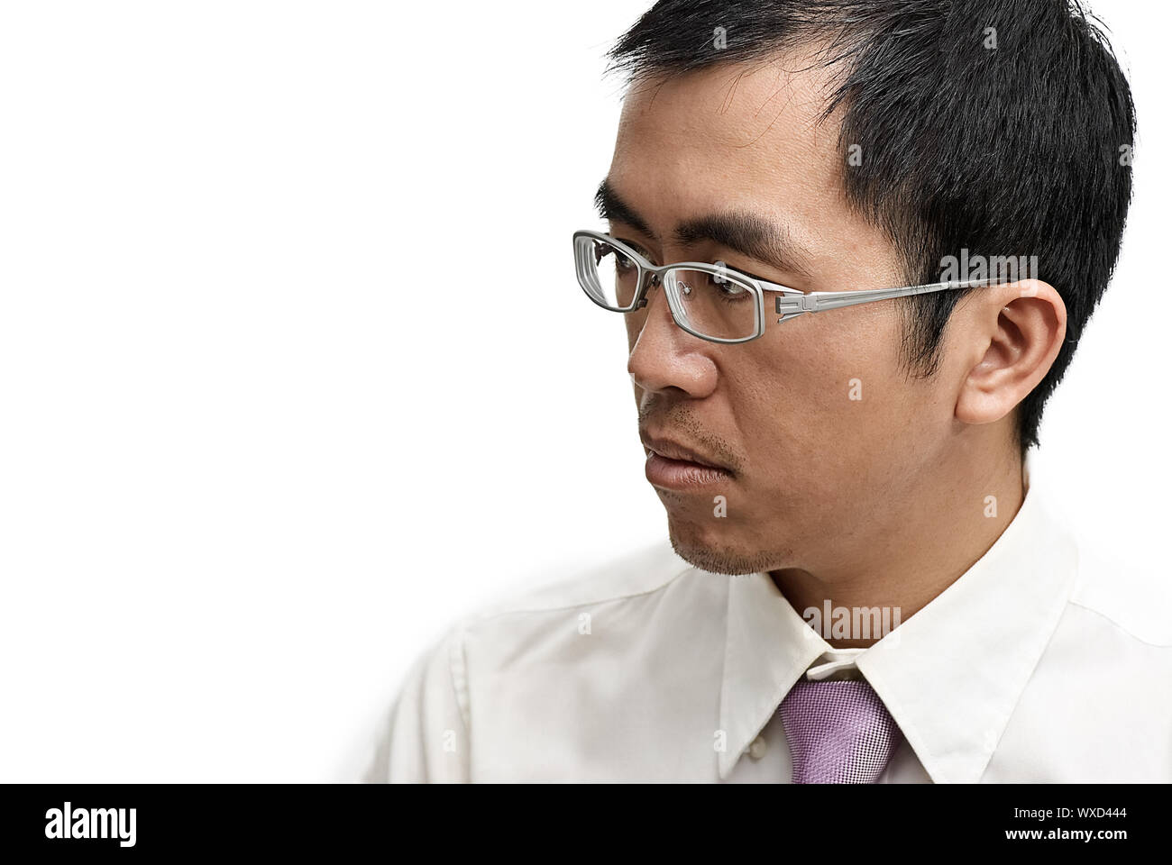 Portrait of businessman with thinking expression alone Stock Photo - Alamy